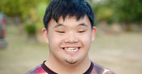 A young Asian male with Down syndrome i... | Stock Video | Pond5