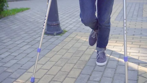 Young asian man with broken leg on crutc... | Stock Video | Pond5