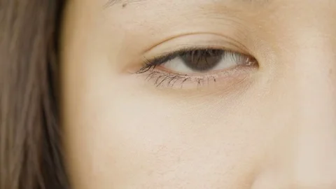 young Asian woman eye: closeup footage | Stock Video | Pond5