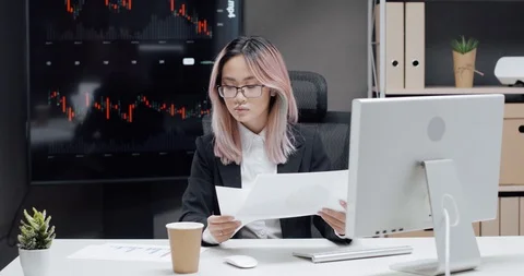 Young asian woman in a modern office, wo... | Stock Video | Pond5