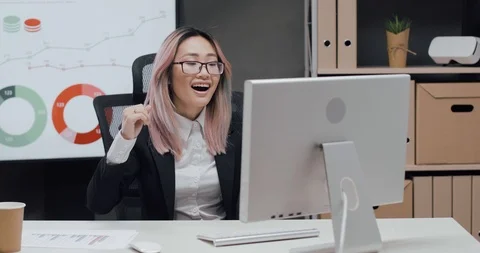 Young asian woman in a modern office, wo... | Stock Video | Pond5