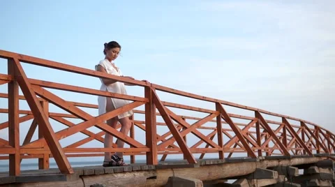 young asian woman posing on pier at the ... | Stock Video | Pond5