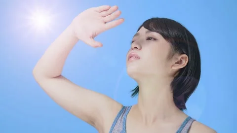 Young asian woman in the sun. UV protect... | Stock Video | Pond5