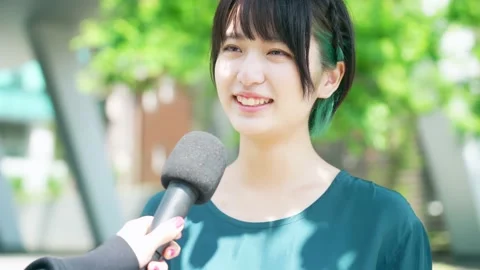 Young asian woman taking interview on th... | Stock Video | Pond5
