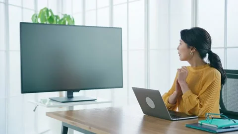 Young Asian woman watching TV screen. | Stock Video | Pond5