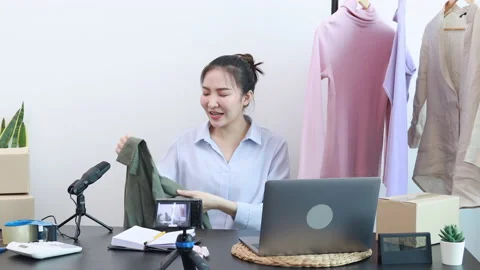 Young Asian women show off the clothes c... | Stock Video | Pond5