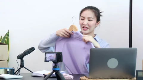 Young Asian women show off the clothes c... | Stock Video | Pond5