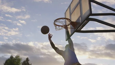Young Athlete Slam Dunking a Ball on a B... | Stock Video | Pond5
