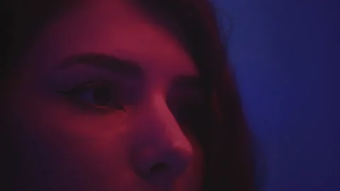 A young attractive girl blinks one eye. ... | Stock Video | Pond5