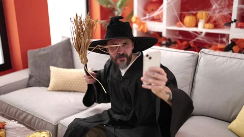 Young bald man wearing wizard costume ma... | Stock Video | Pond5