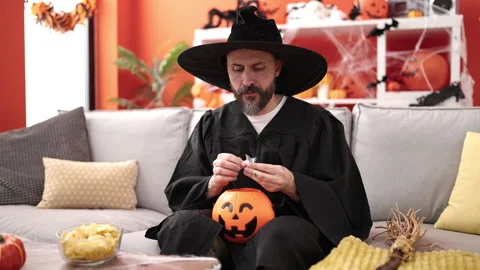 Young bald man wearing wizard costume ho... | Stock Video | Pond5