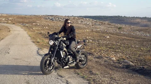Young biker woman Drive Ride on Motorcy... | Stock Video | Pond5