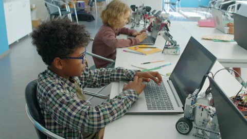 Young Black Boy Writing Computer Code in... | Stock Video | Pond5