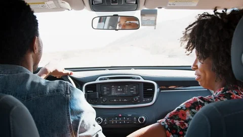 Young black couple driving on desert roa... | Stock Video | Pond5