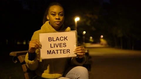 A young black woman shows a Black Lives ... | Stock Video | Pond5