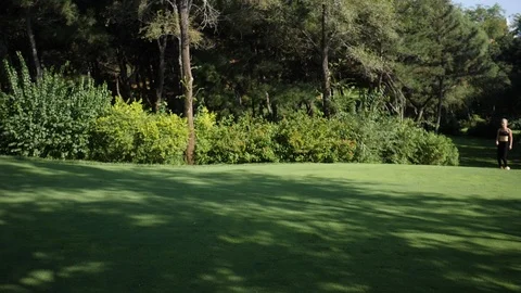 Young blond woman with a slender figure ... | Stock Video | Pond5