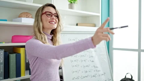 Young blonde woman teacher teaching math... | Stock Video | Pond5