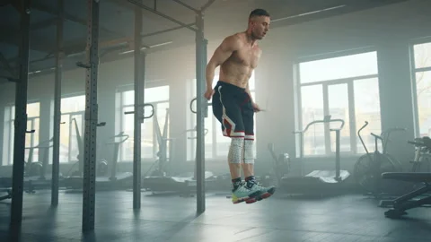 Young boxer jumps with two feet together... | Stock Video | Pond5