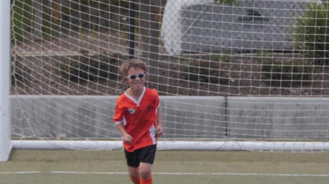 Young boy celebrating scoring a goal whi... | Stock Video | Pond5