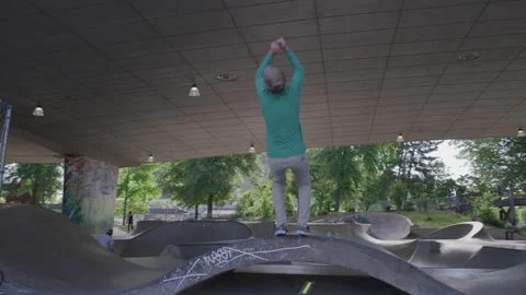 A Young Boy Does a Backflip Off a Ramp a... | Stock Video | Pond5