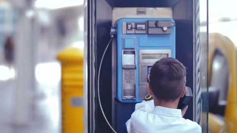 Young Boy Engaging in a Phone Call Insid... | Stock Video | Pond5