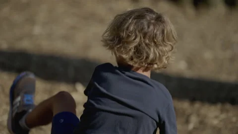 Young boy falling into ground from playg... | Stock Video | Pond5