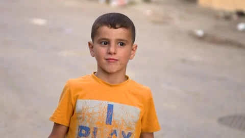 A young boy in Gaza looking at the camer... | Stock Video | Pond5
