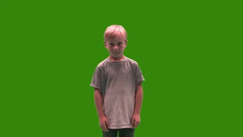 young boy on green screen holding his ha... | Stock Video | Pond5