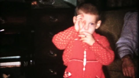 young boy imitates dad smoking a cigaret... | Stock Video | Pond5