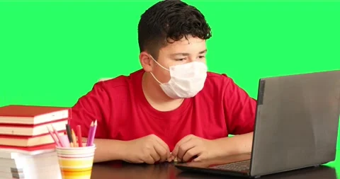 Young boy with laptop at green screen ba... | Stock Video | Pond5