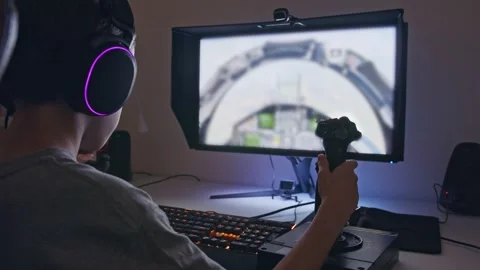 Young boy playing a flight simulator wea... | Stock Video | Pond5