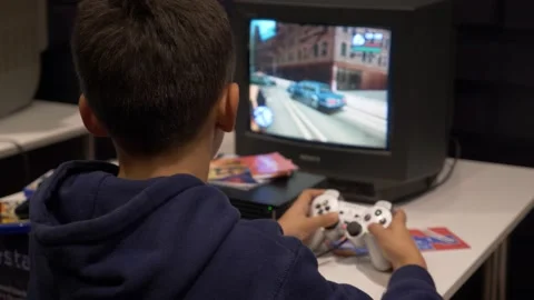 Young boy playing old school computer ga... | Stock Video | Pond5