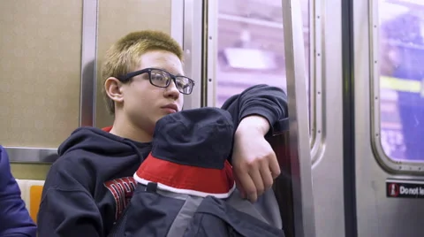 Young boy riding subway train in city 4k | Stock Video | Pond5