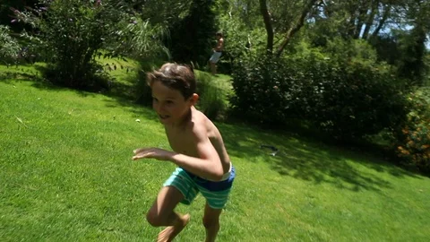 Young boy running and jumping into swimm... | Stock Video | Pond5