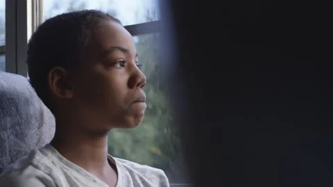 Young Boy Sits Sad On School Bus | Stock Video | Pond5