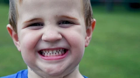 A young boy smiling with water dripping ... | Stock Video | Pond5