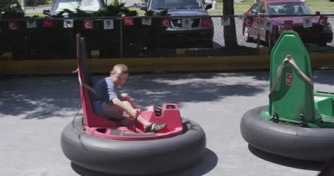 Young boy spinning around in an old styl... | Stock Video | Pond5