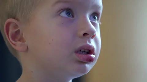 young boy with a swollen, split lip look... | Stock Video | Pond5