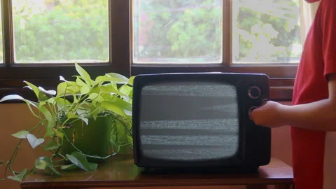Young Boy Turning On a Retro TV with Blu... | Stock Video | Pond5
