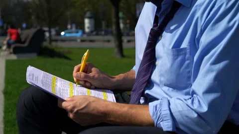 Young businessman writing notes in docum... | Stock Video | Pond5