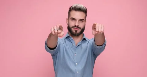 young casual man pointing at the camera ... | Stock Video | Pond5
