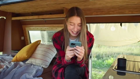 Young caucasian girl sitting in camper v... | Stock Video | Pond5