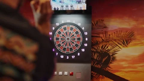Young caucasian man throwing darts in ca... | Stock Video | Pond5