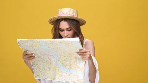 Young cheerful lady using map and plans ... | Stock Video | Pond5