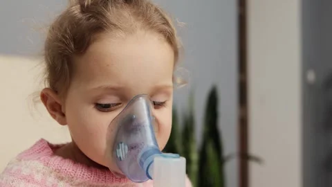 A young child is calmly receiving respir... | Stock Video | Pond5