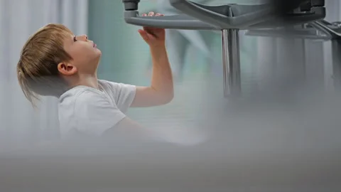 Young child distracted in class moving a... | Stock Video | Pond5