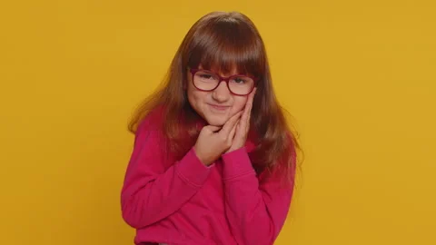 Young child girl kid touching cheek terr... | Stock Video | Pond5