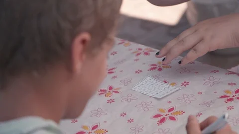 young child is playing bingo with a card | Stock Video | Pond5