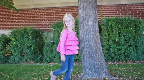 Young Child Walking Around Tree HD | Stock Video | Pond5