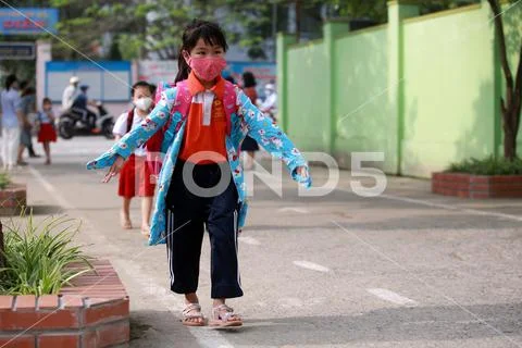 Young children from kindergarten and elementary school return to class ...